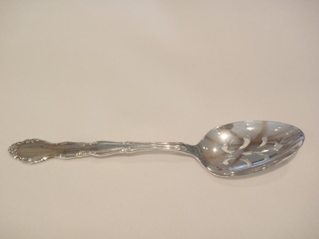 Rent a silver slotted serving spoon at All Seasons Rent All